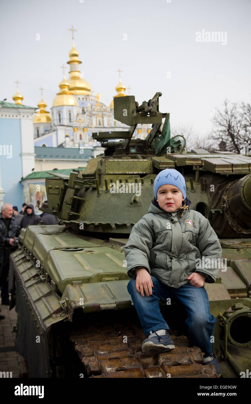 A Ukrainian child poses for photo on the captured Russian tank. The ...