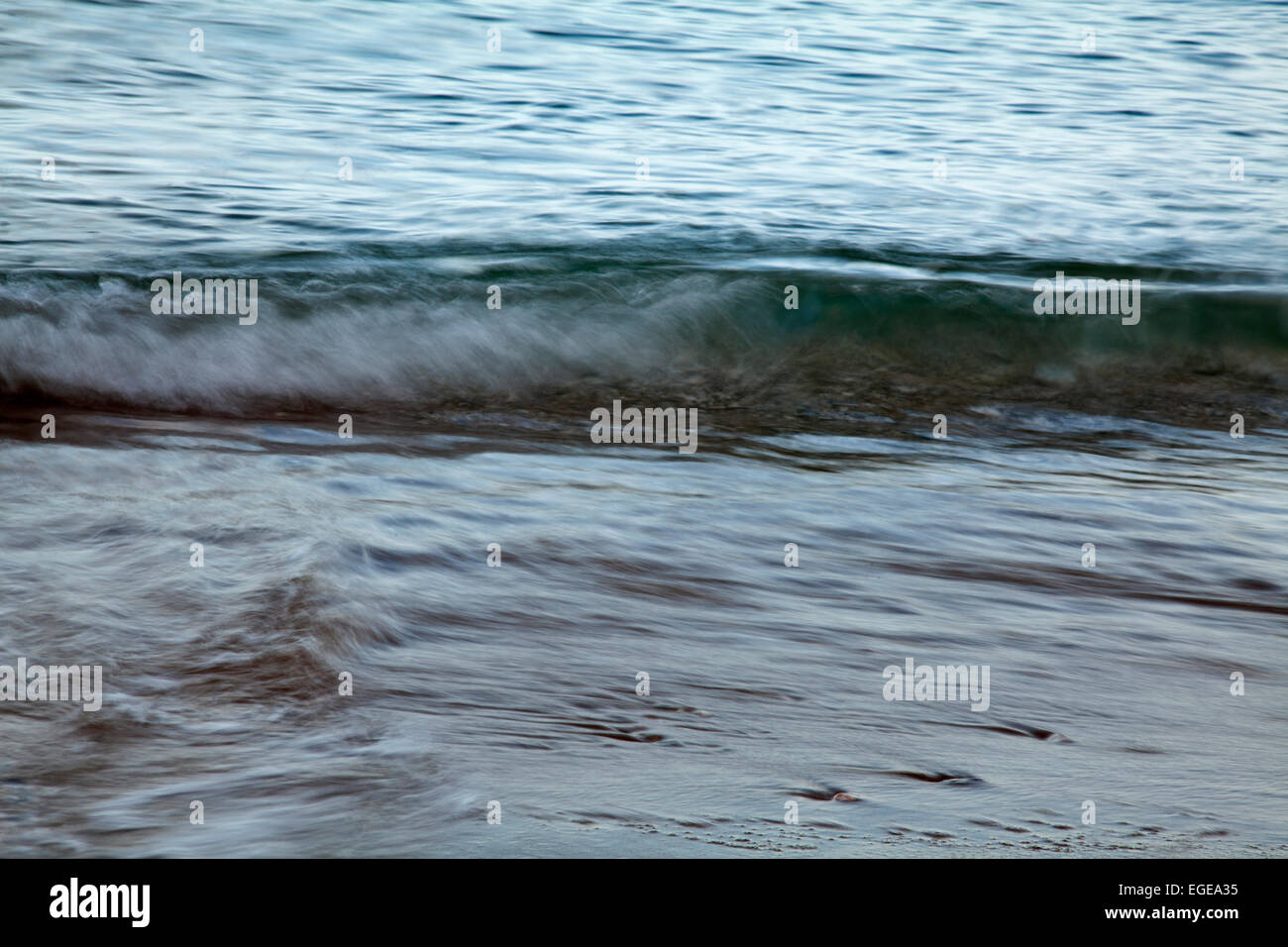 Shoreline wave motion blur Stock Photo - Alamy