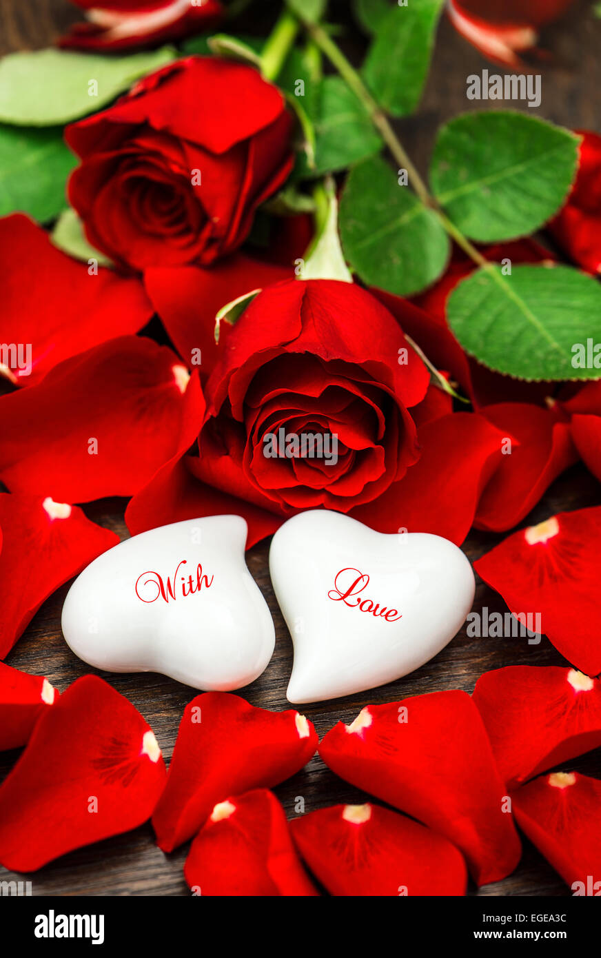 Red roses and two white hearts. Valentines Day decoration. Sample text ...