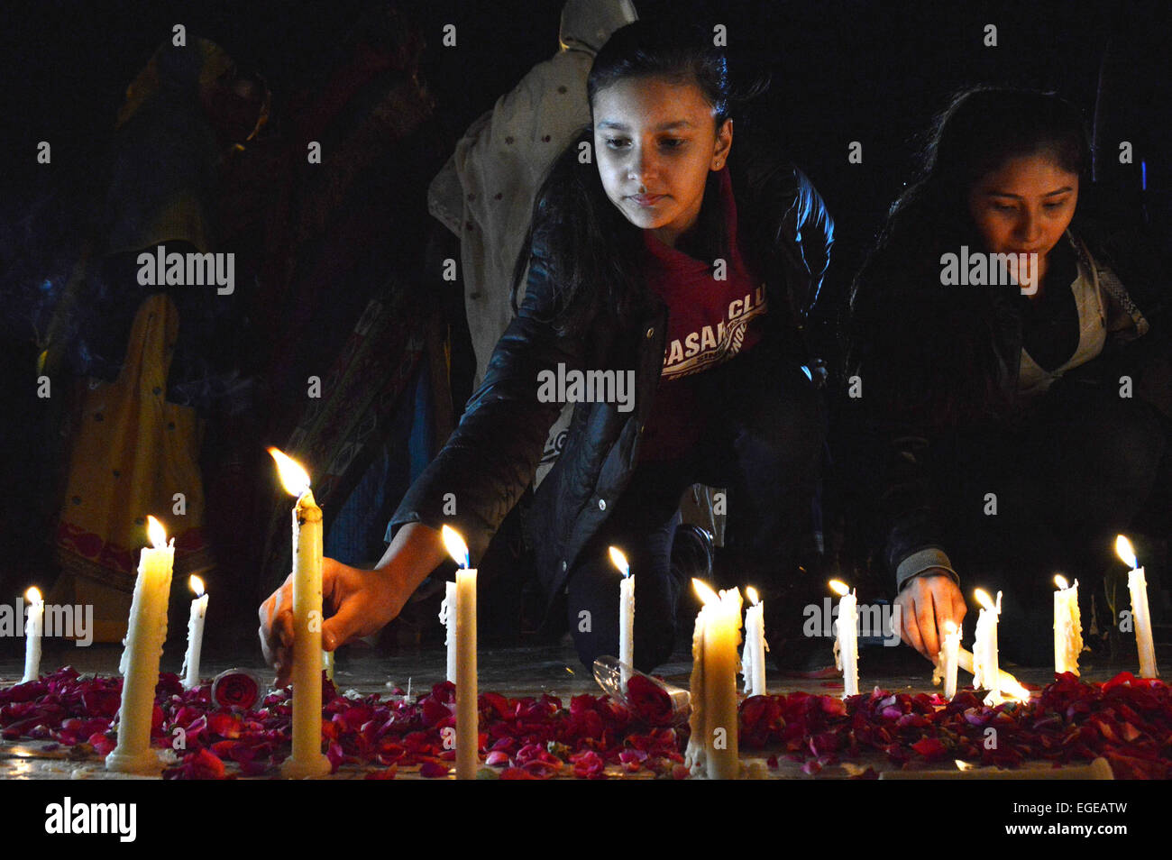 Quetta. 23rd Feb, 2015. People light candles during a vigil ceremony ...