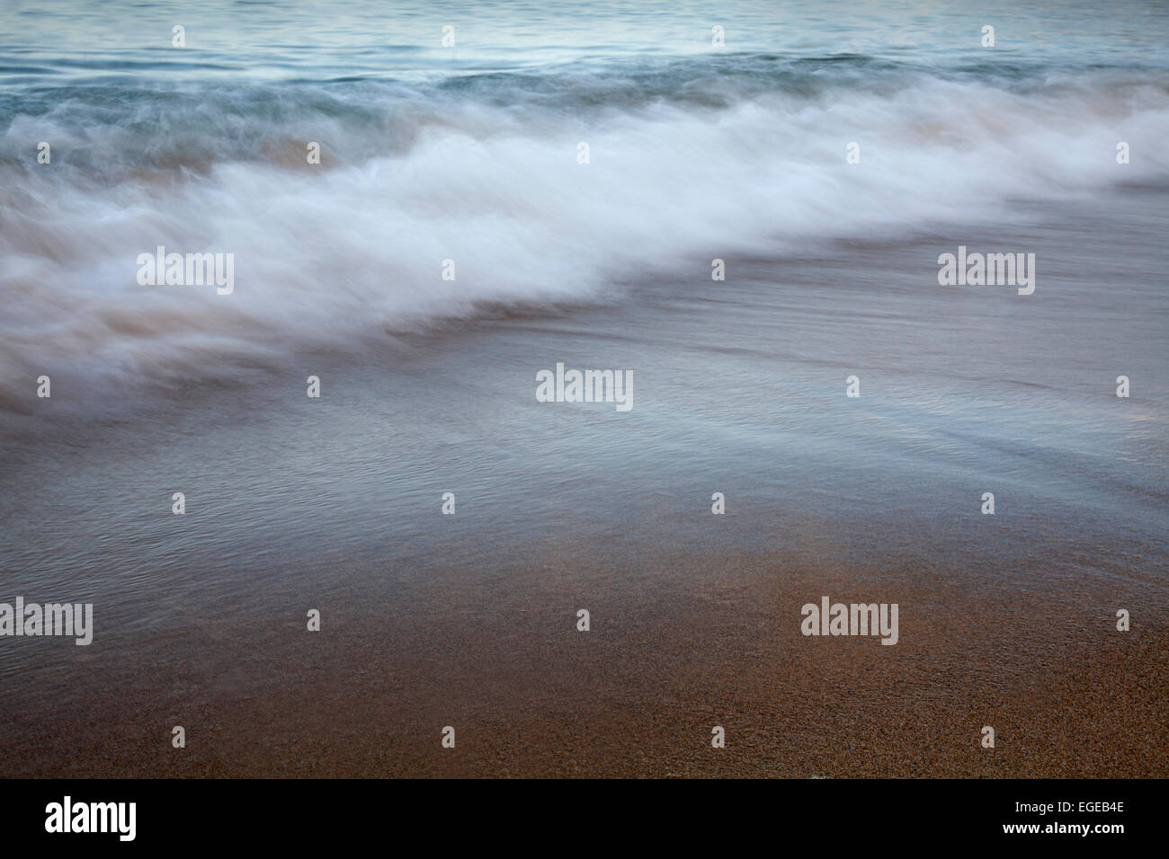 Shoreline wave motion blur Stock Photo - Alamy