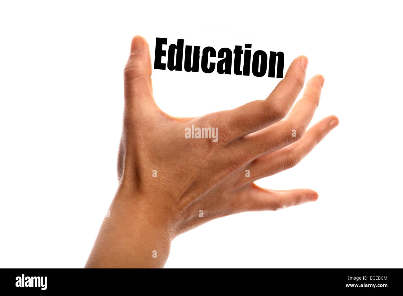 Horizontal shot of a hand holding the word "Education" between two ...