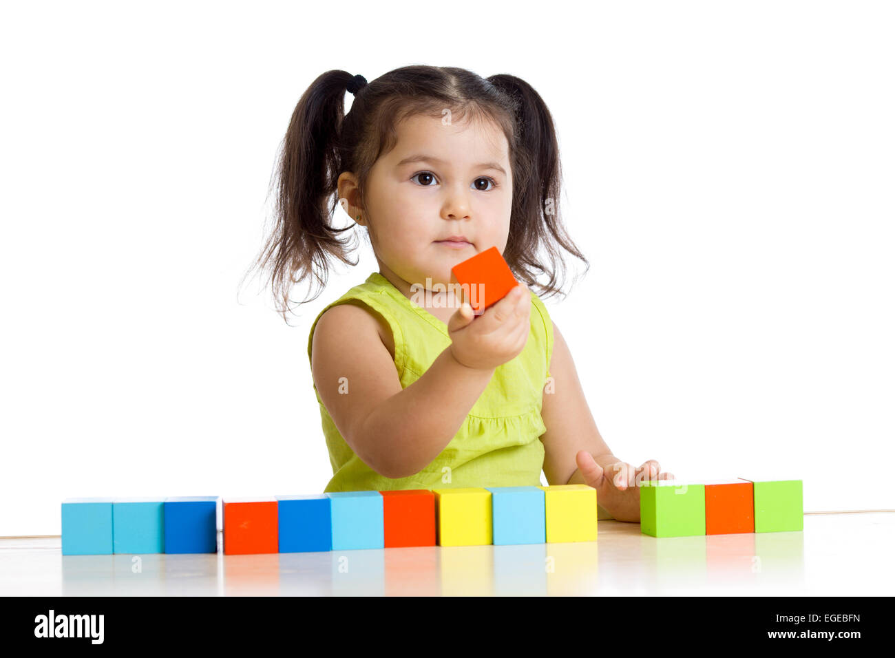 kid plays with building blocks and learning of colors Stock Photo - Alamy