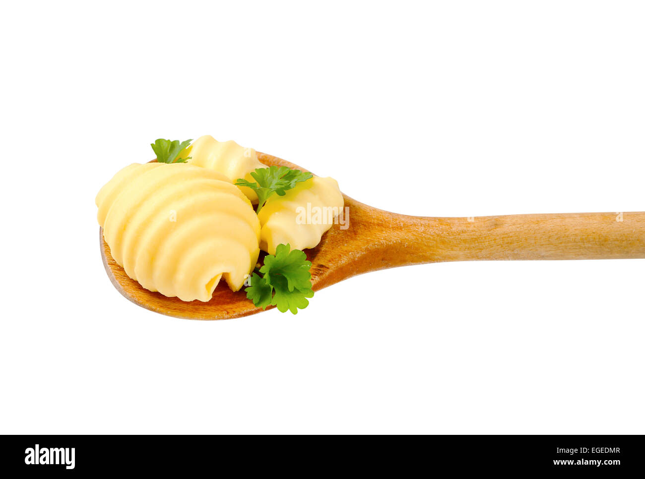 Butter curls on wooden spoon Stock Photo - Alamy