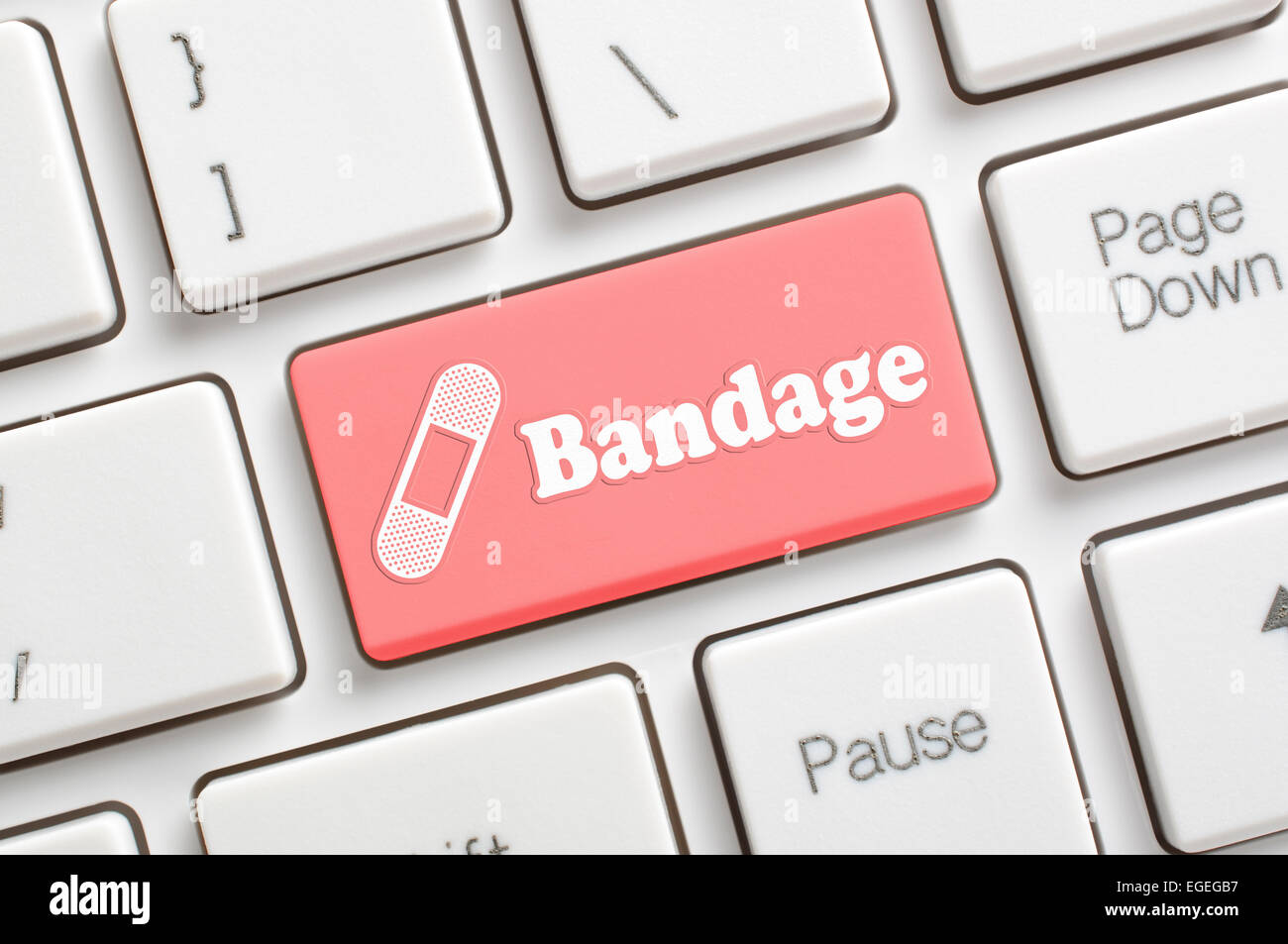 Red bandage key on keyboard Stock Photo - Alamy
