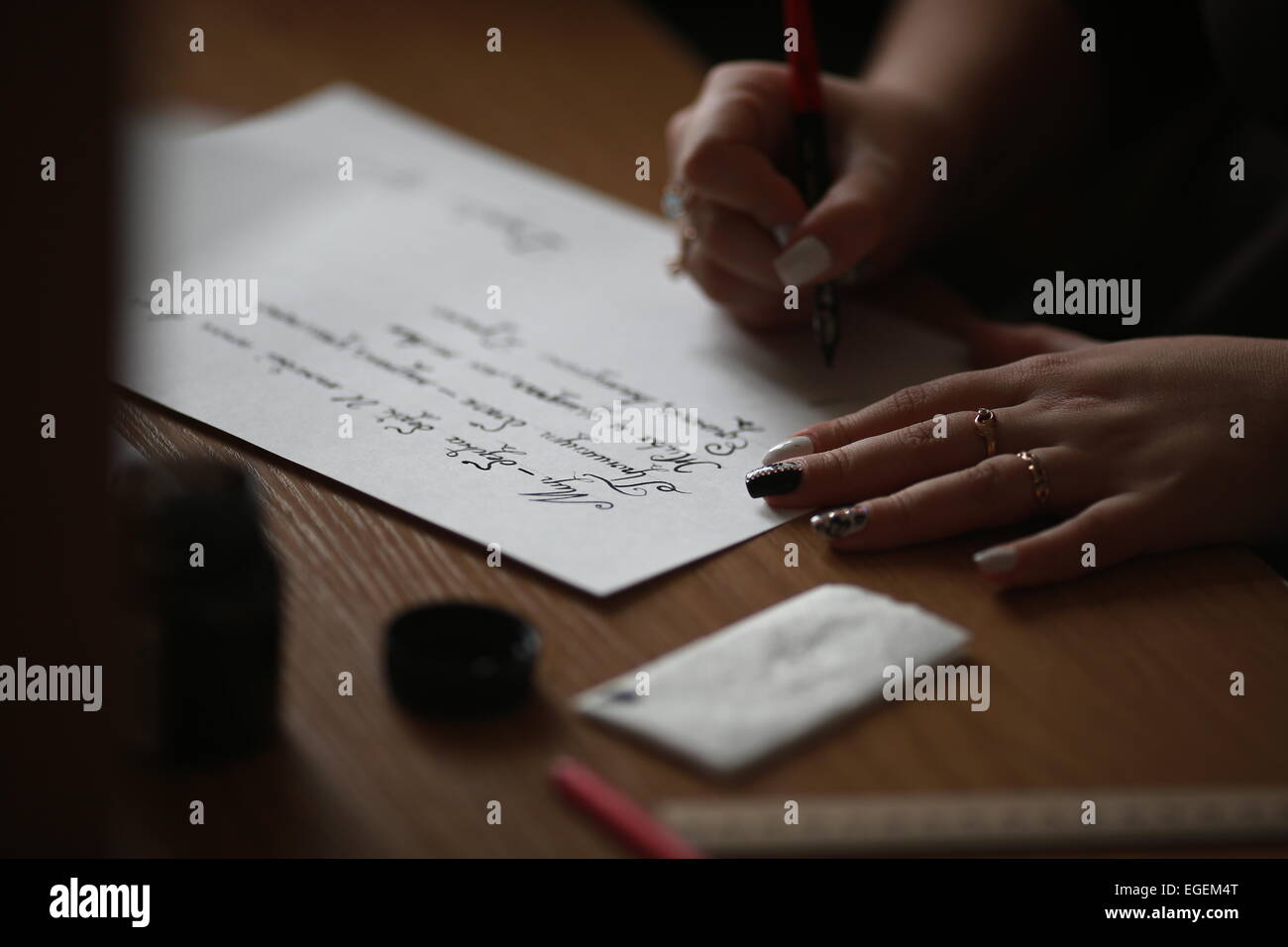 The girl writes a letter with pen and ink Stock Photo - Alamy