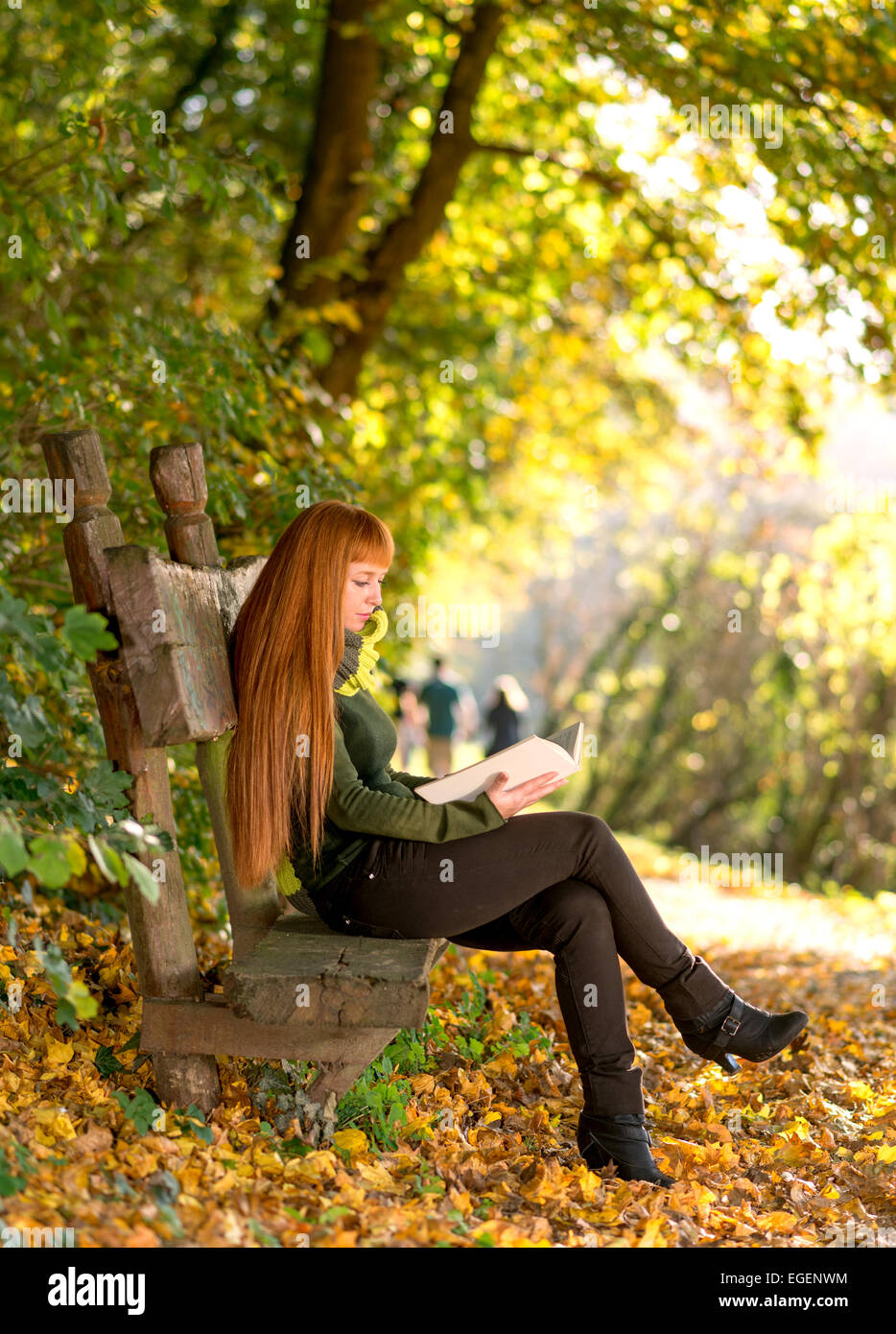 Woman reading in the autumn nature Stock Photo - Alamy