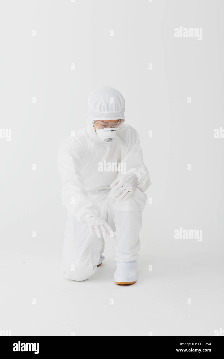 Young Japanese man in a protective suit Stock Photo - Alamy