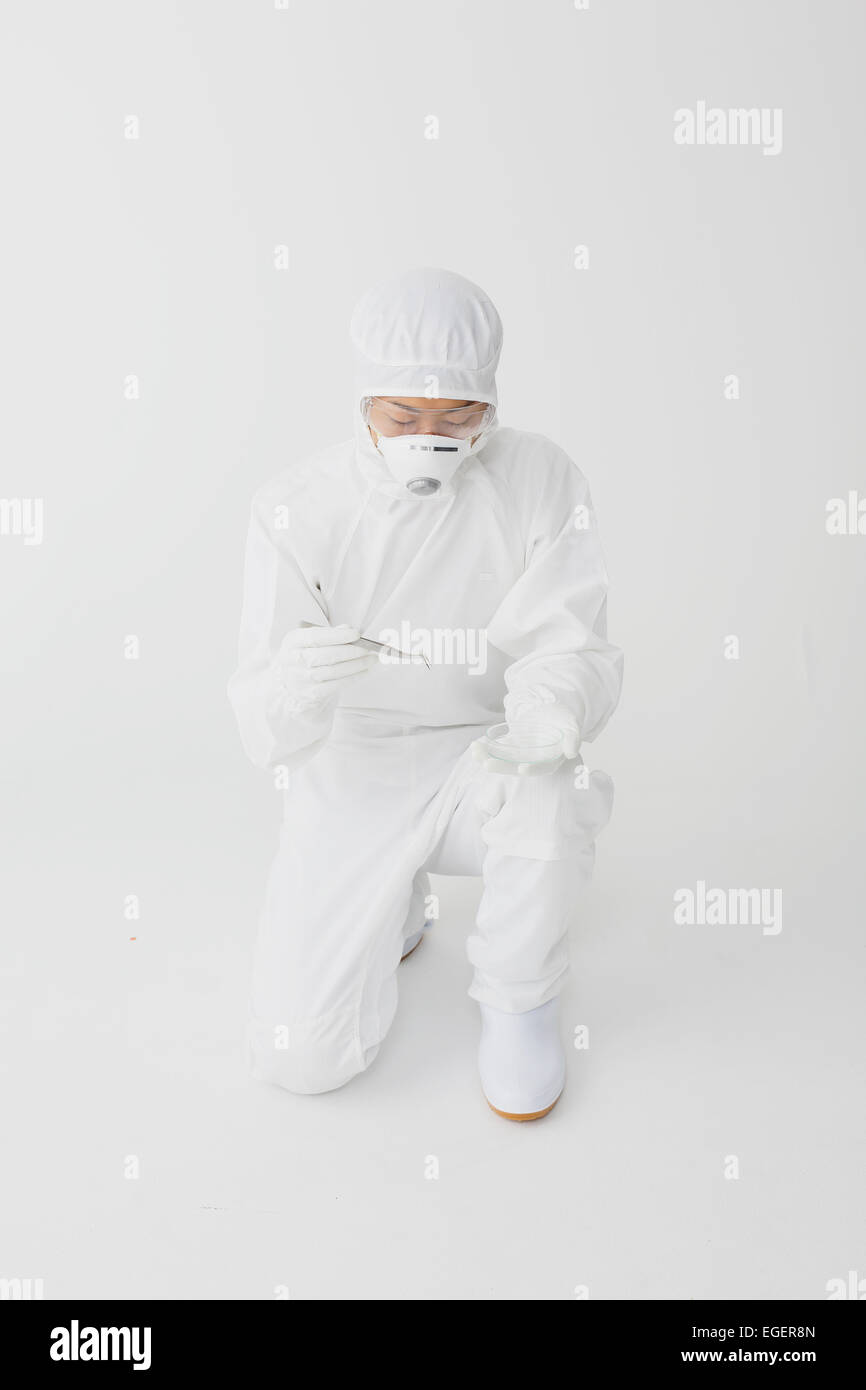 Young Japanese man in a protective suit Stock Photo - Alamy
