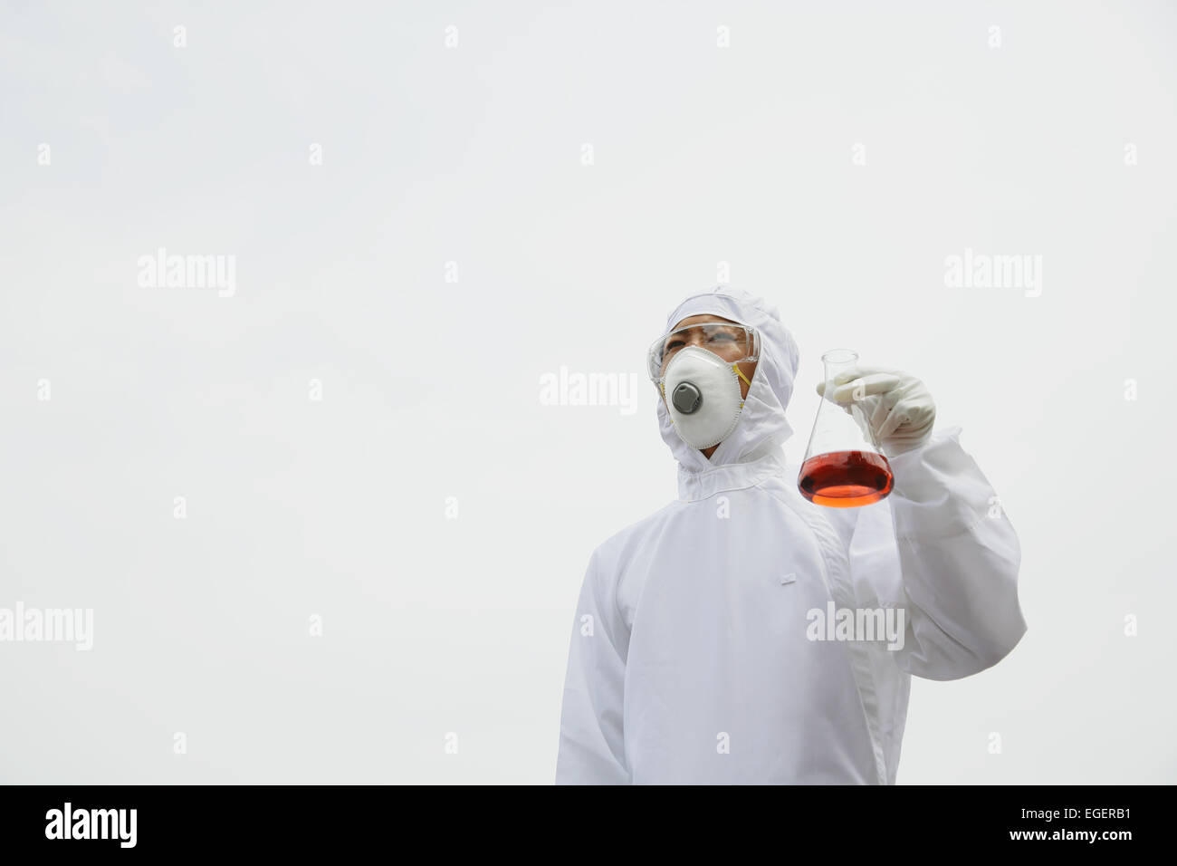 Young Japanese man in a protective suit Stock Photo - Alamy