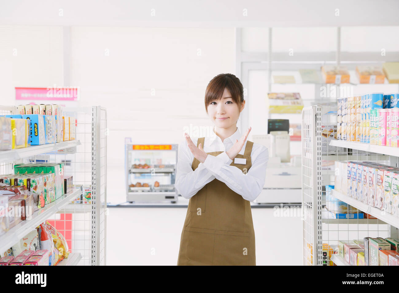 Young Japanese woman working at convenience store Stock Photo - Alamy