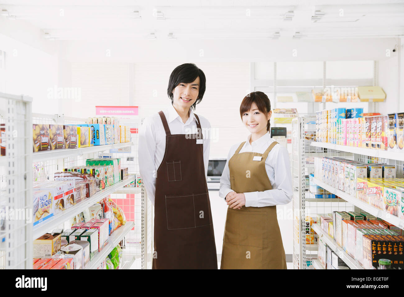 Convenience store staff working Stock Photo - Alamy