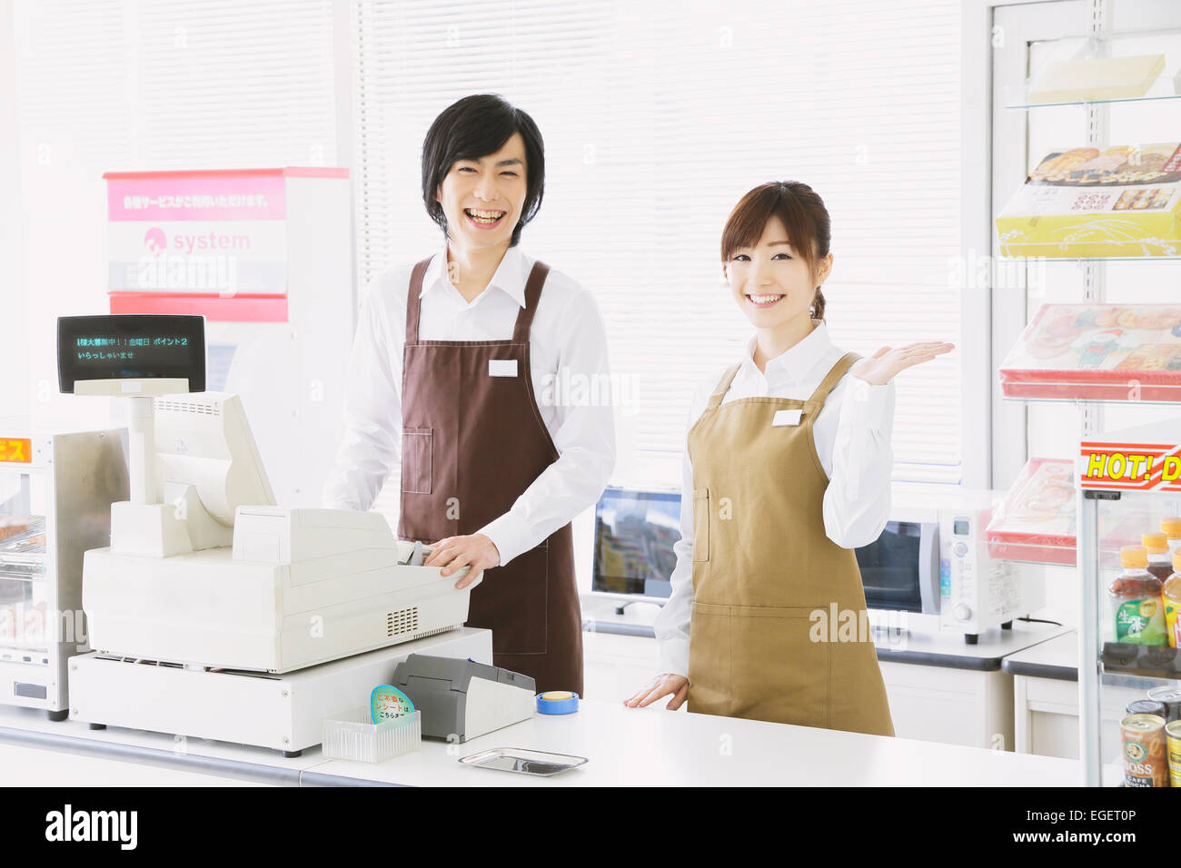 Convenience store staff working Stock Photo - Alamy