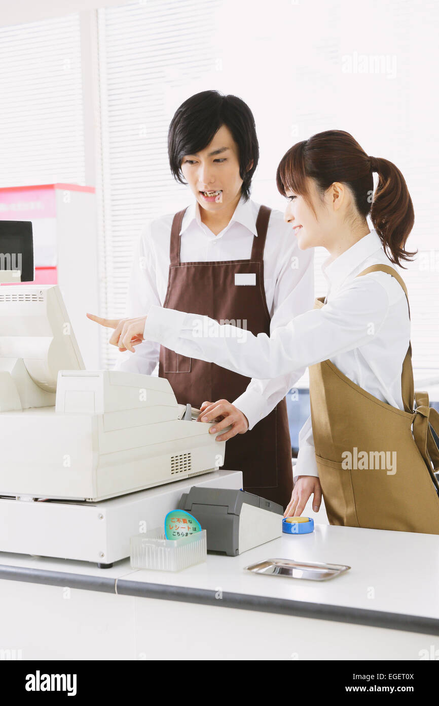 Convenience store staff working Stock Photo - Alamy