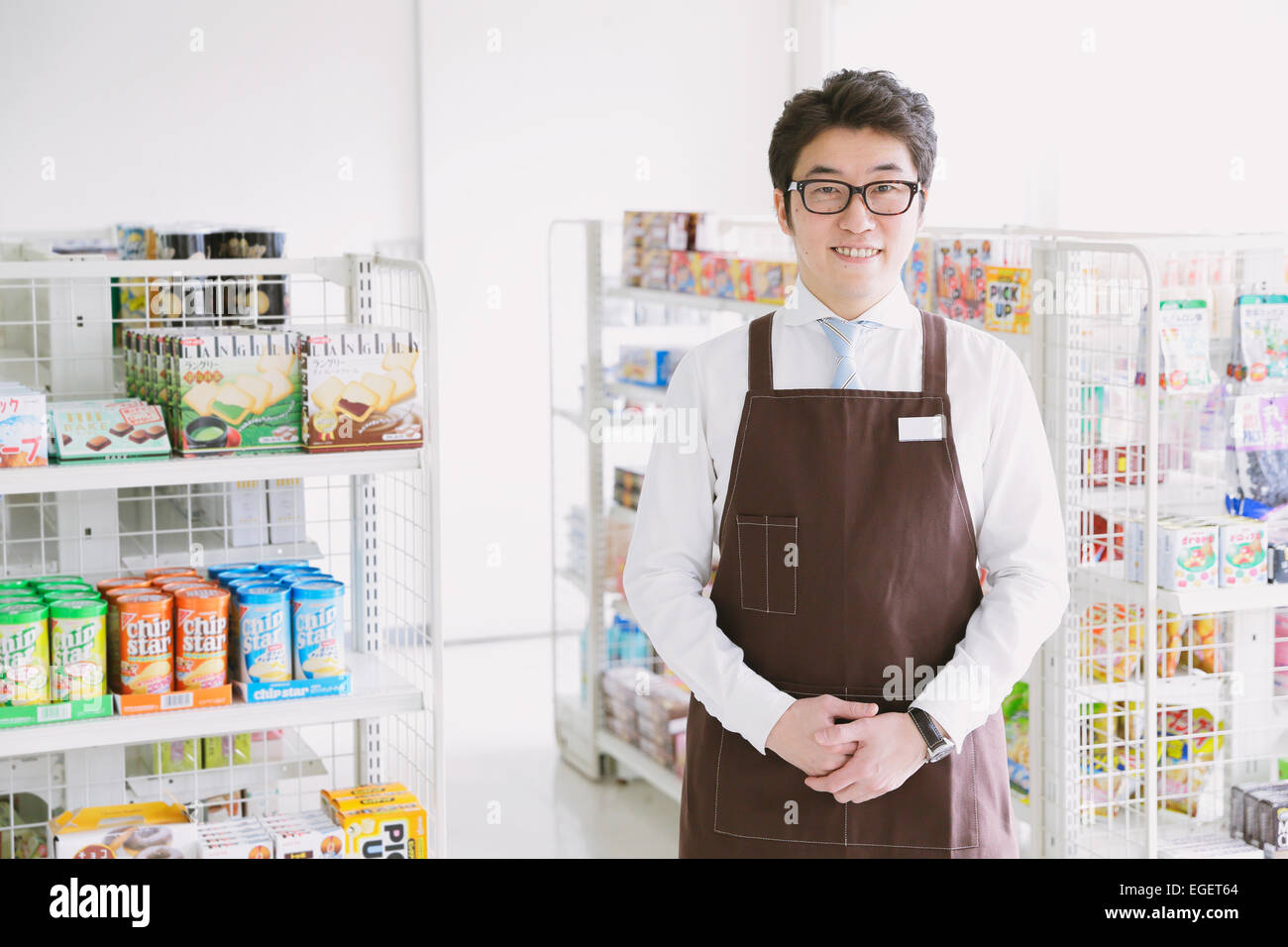 Japanese man working at convenience store Stock Photo - Alamy