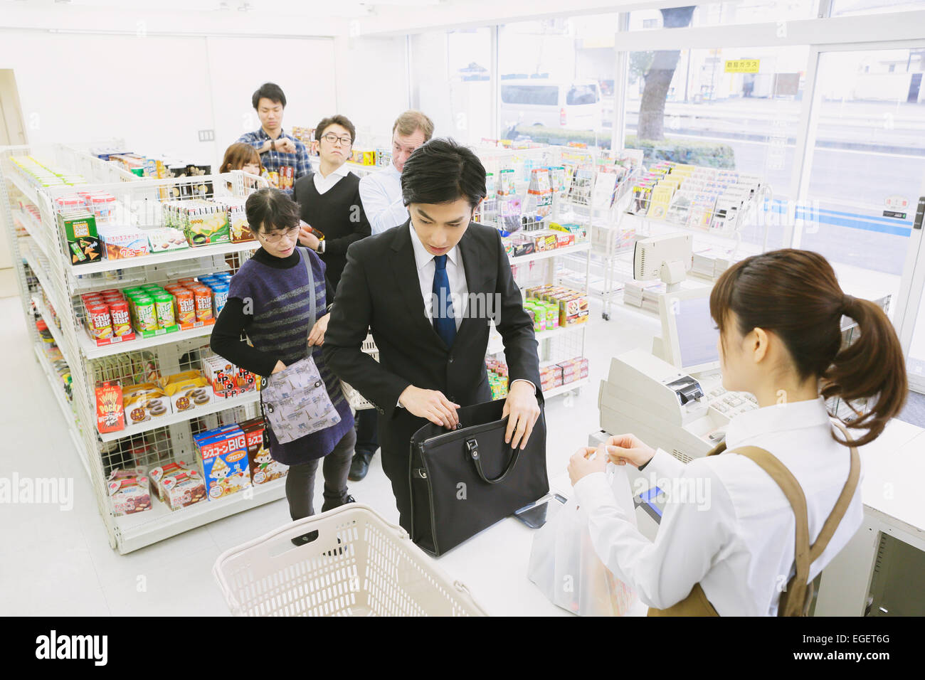 Customers shopping at a convenience store Stock Photo - Alamy