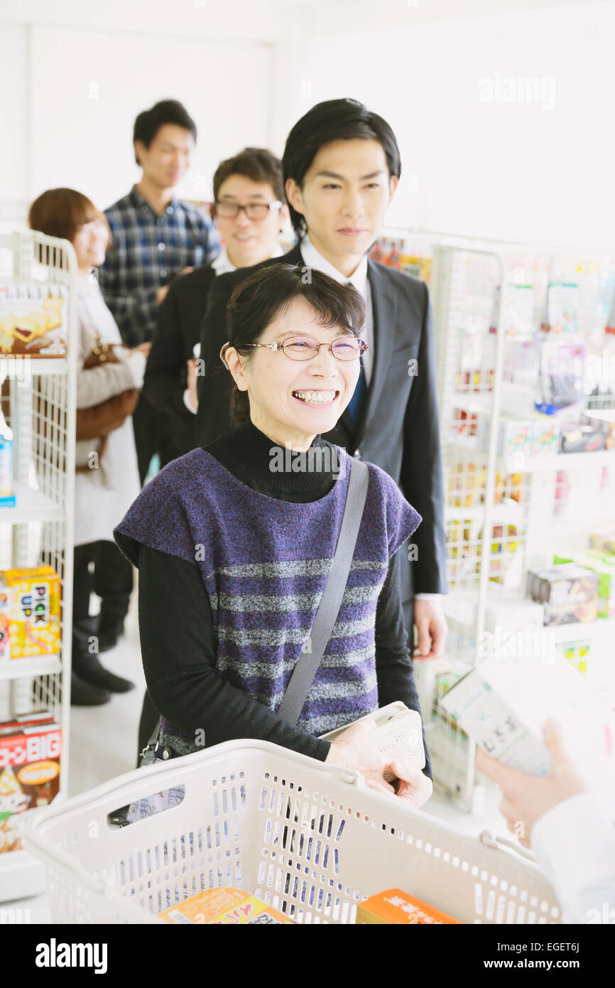 Customers shopping at a convenience store Stock Photo - Alamy