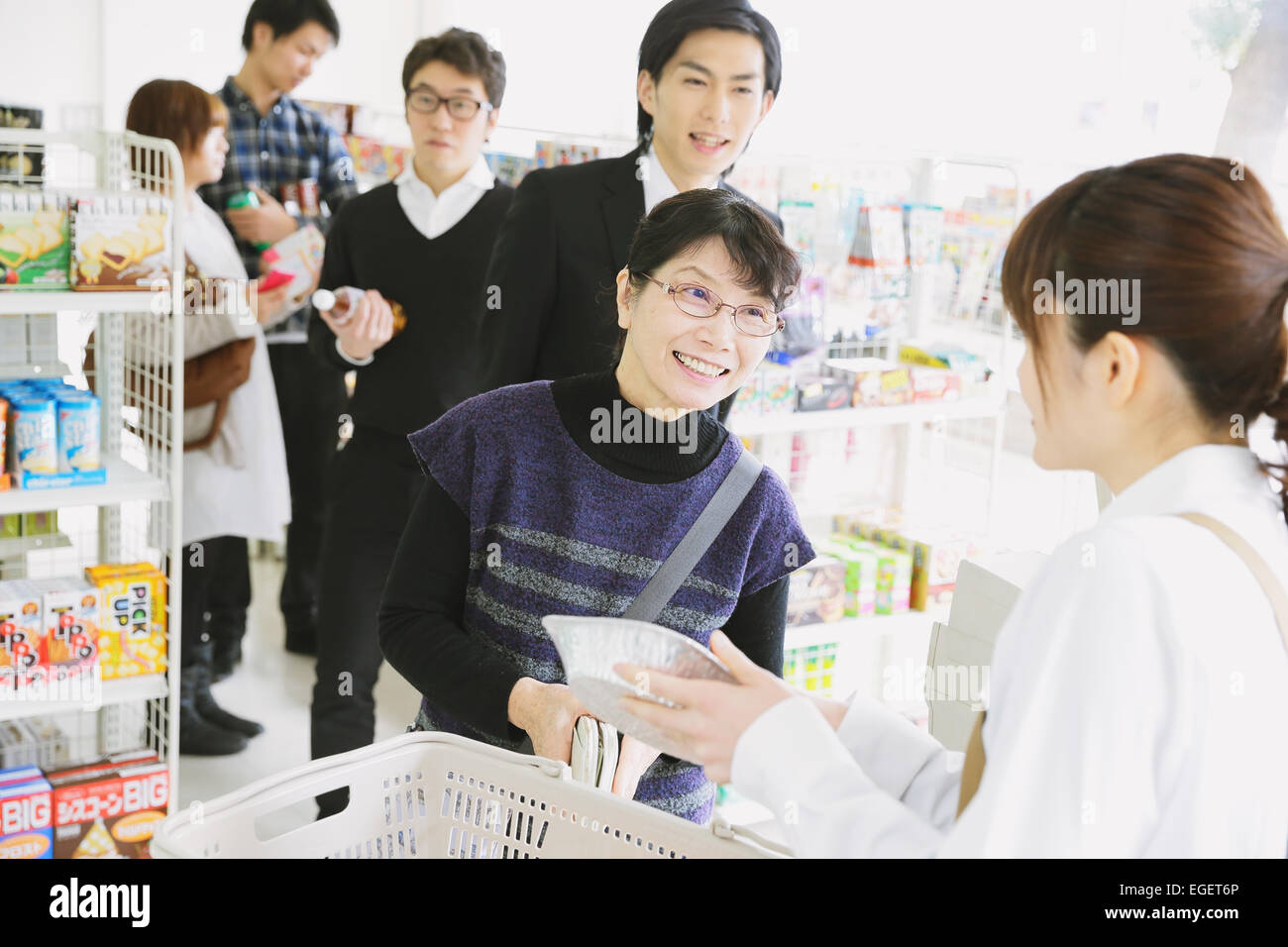 Customers shopping at a convenience store Stock Photo - Alamy