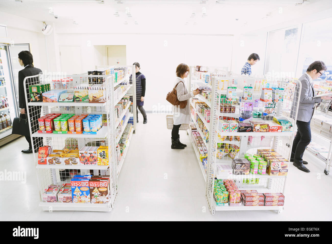 Customers shopping at a convenience store Stock Photo - Alamy