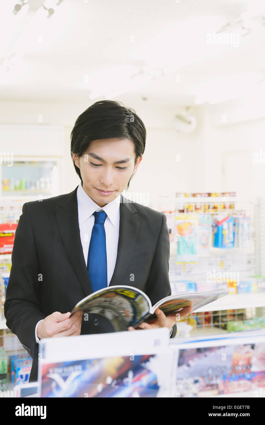 Young Japanese businessman in a convenience store Stock Photo - Alamy