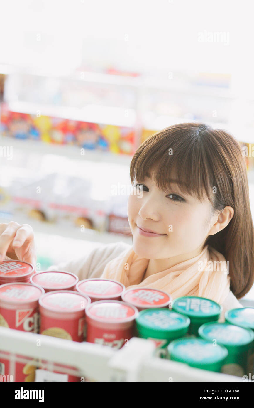 Young Japanese woman in a convenience store Stock Photo - Alamy