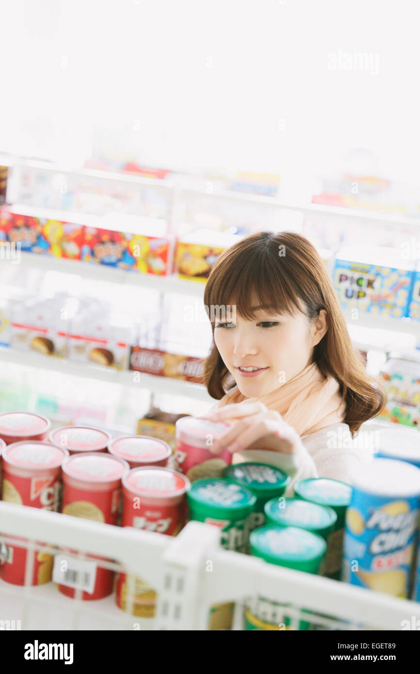 Young Japanese woman in a convenience store Stock Photo - Alamy