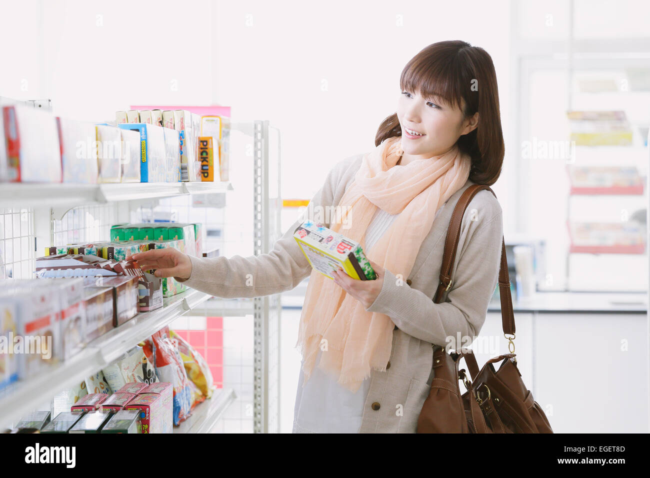 Young Japanese woman in a convenience store Stock Photo - Alamy