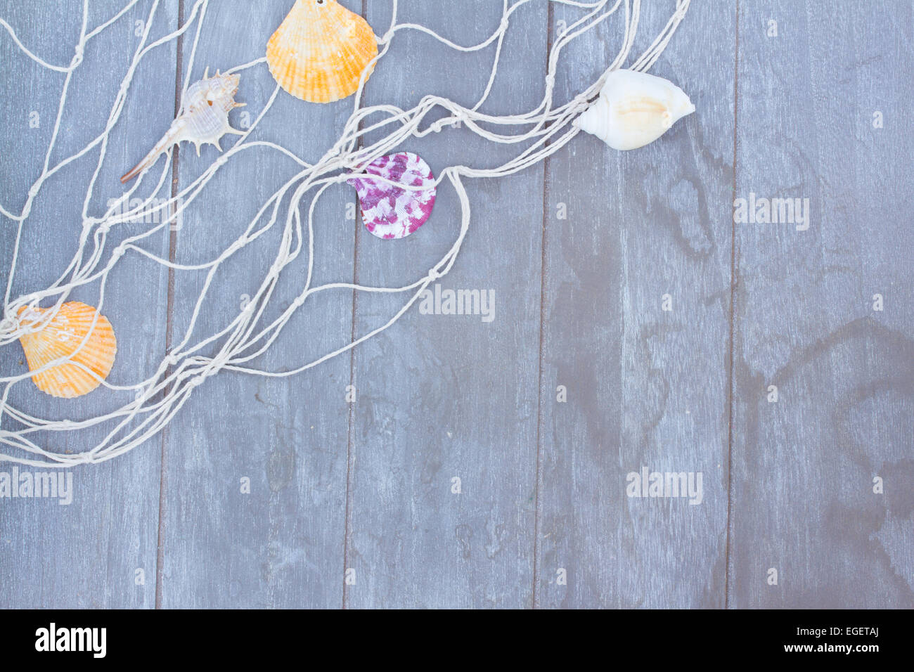 fishing net on wooden background Stock Photo - Alamy