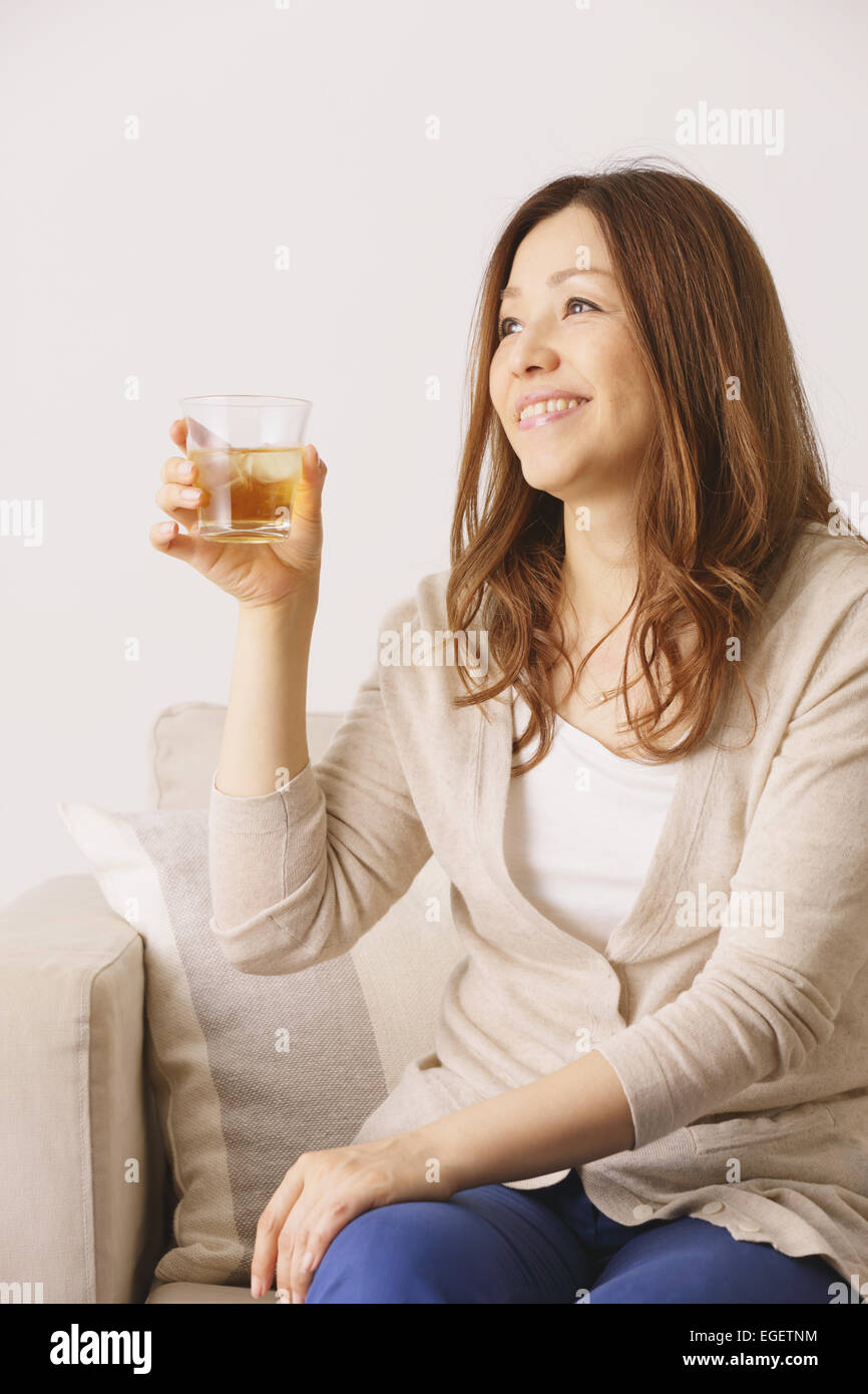 Japanese Woman Drinking Iced Tea Stock Photo - Alamy