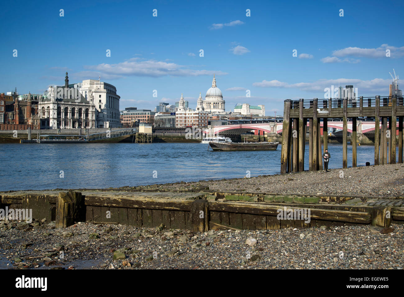 Low tide River Thames and London city skyline including St Paul's ...