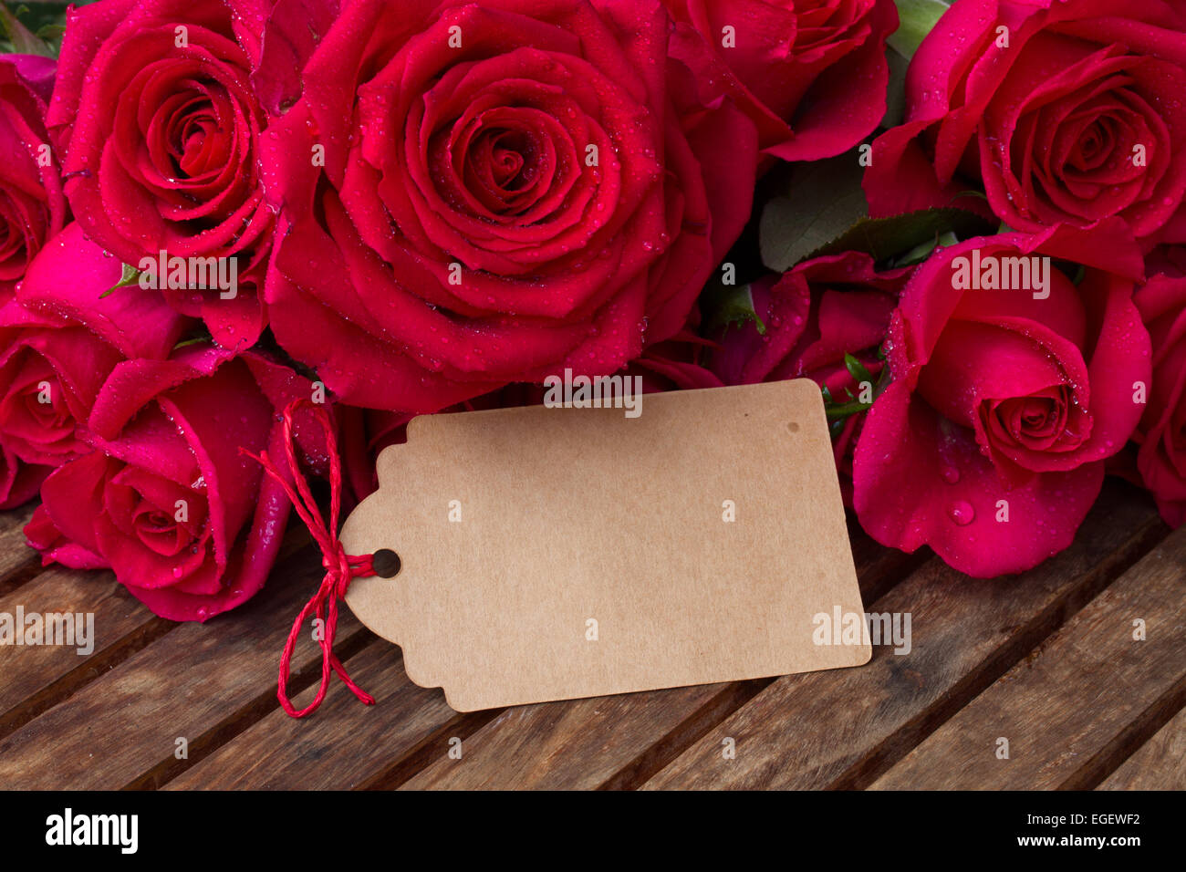 dark pink roses with hearts and tag Stock Photo - Alamy