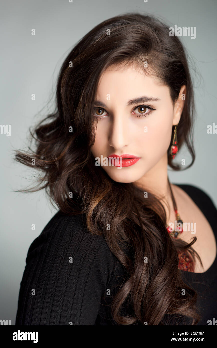 Hispanic model look on grey background Stock Photo - Alamy