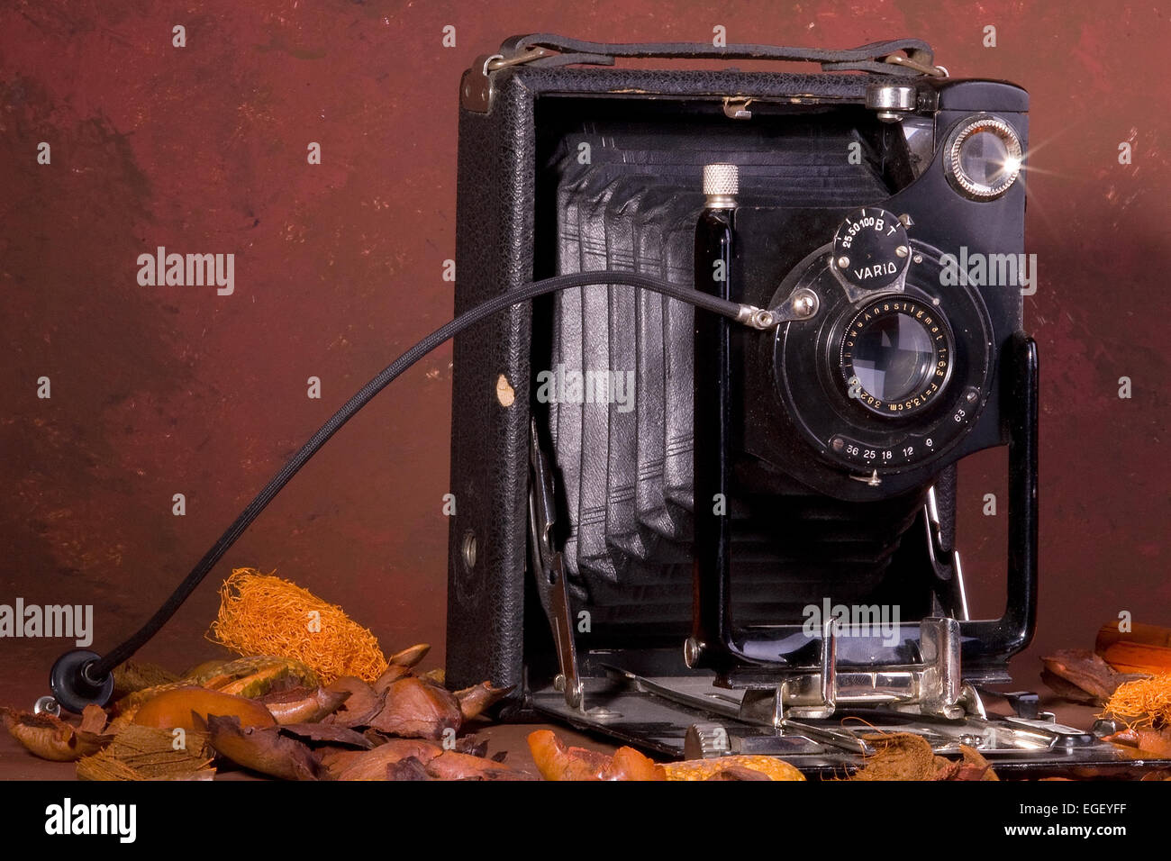 Old-time rusty photo-camera on brown background Stock Photo - Alamy