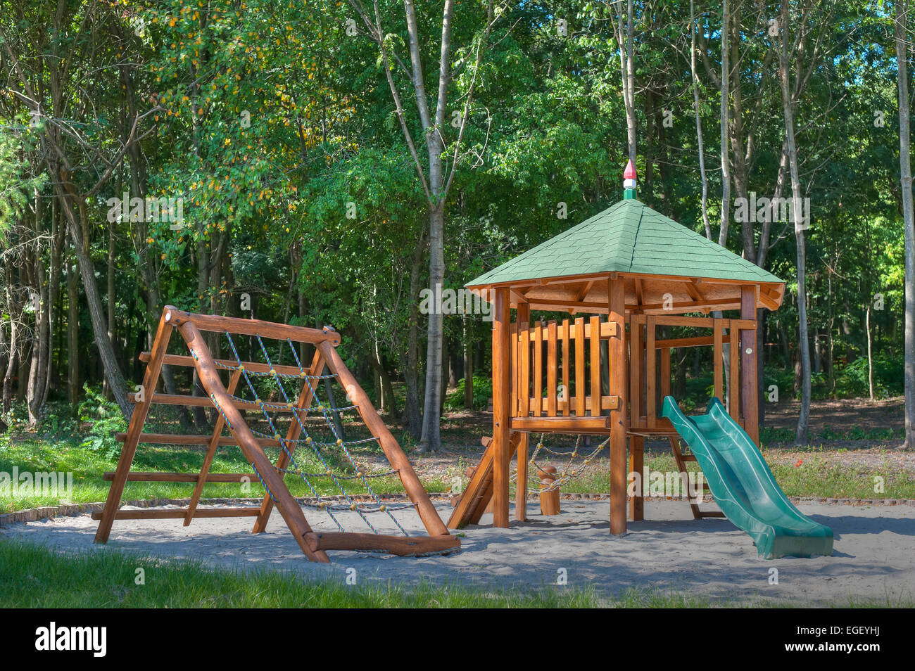 Wooden Playground toys with steps and chute Stock Photo - Alamy