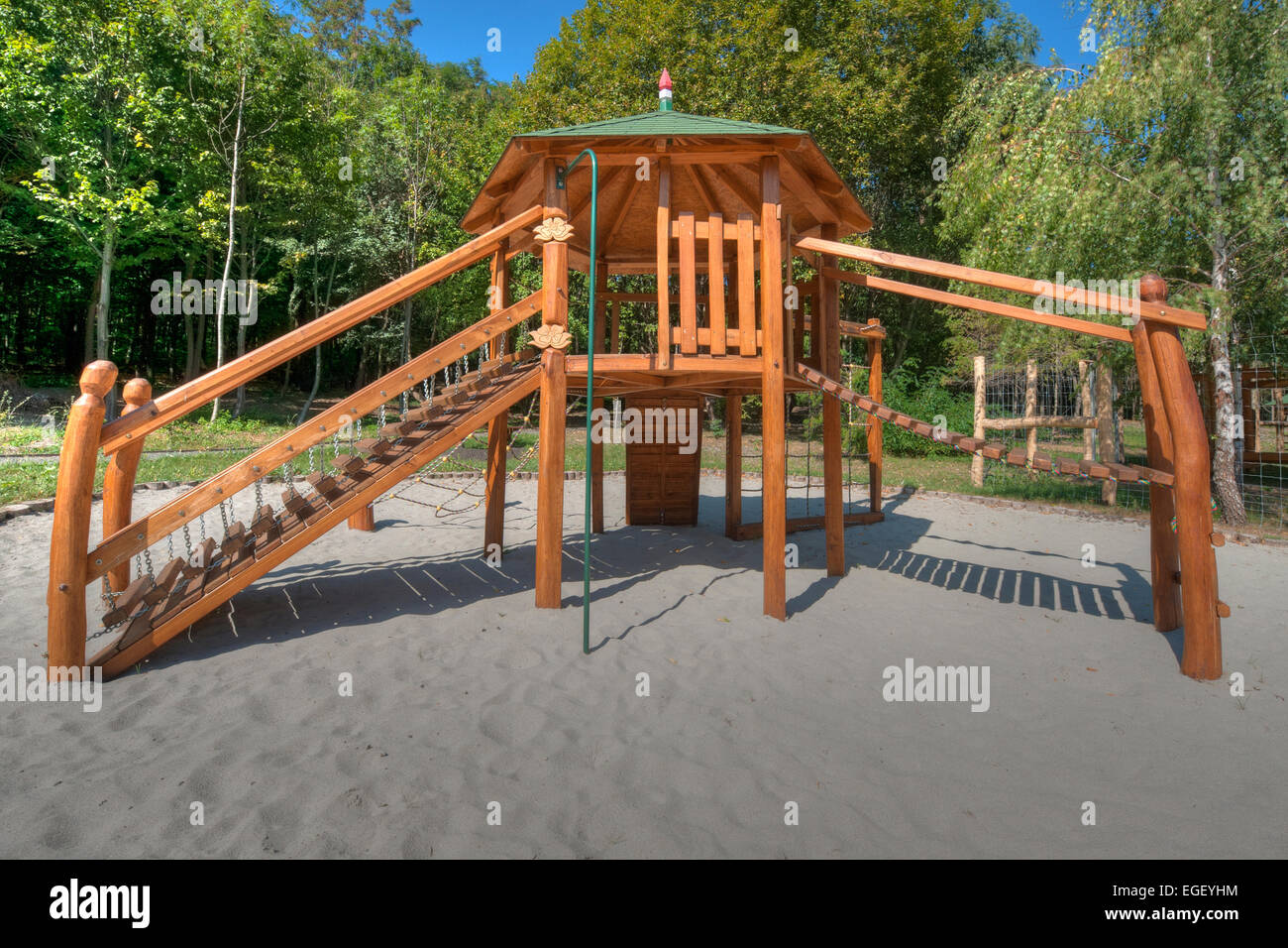 Wooden Playground toys with steps and chute Stock Photo - Alamy