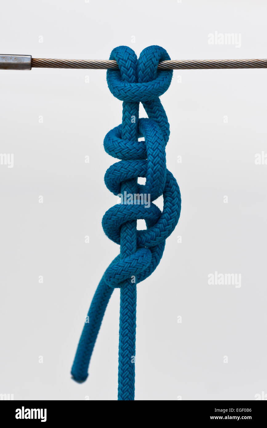 A mooring rope with a knotted end tied around a lifeline Stock Photo ...