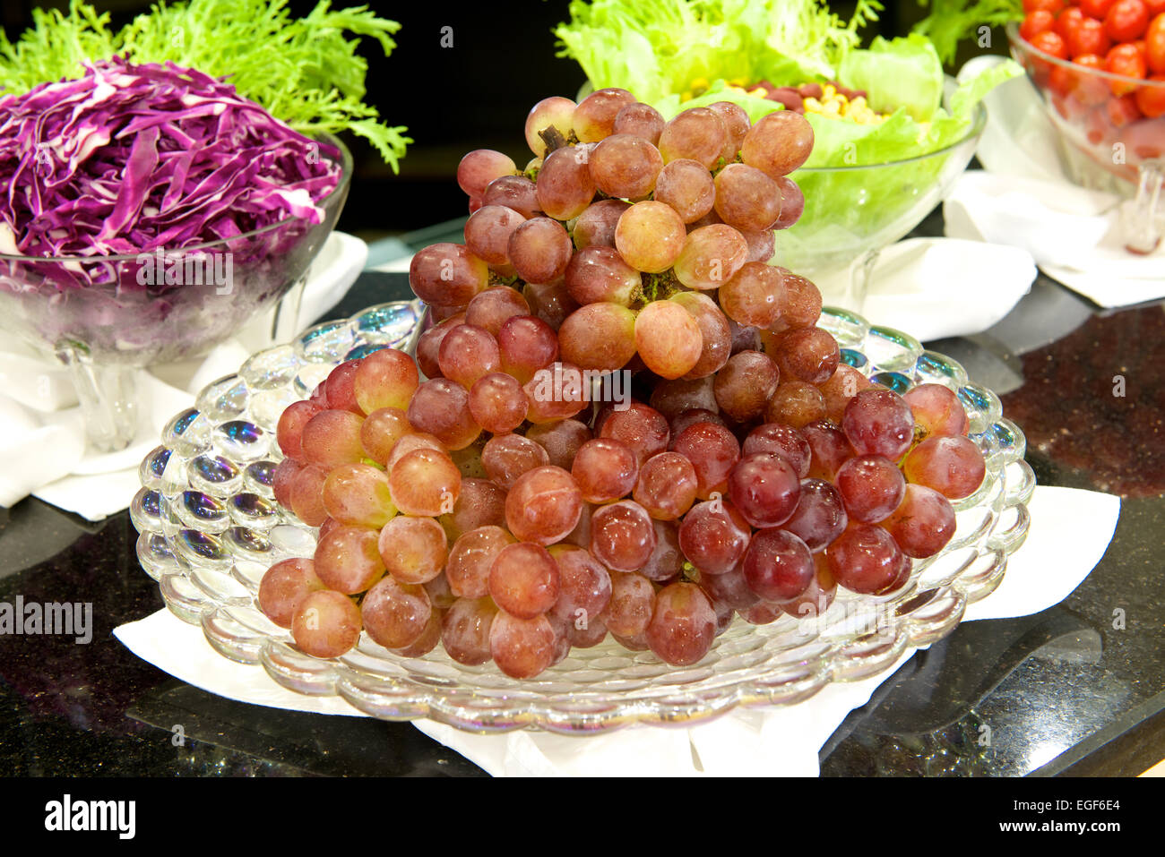 Grapes and vegetable in a buffet line Stock Photo - Alamy