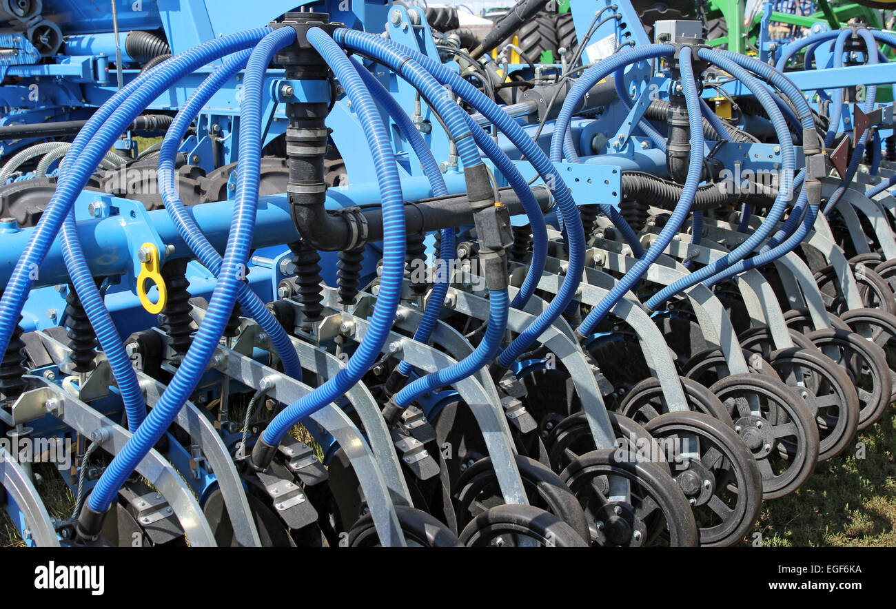 tractor and seeder planting crops on a field Stock Photo - Alamy