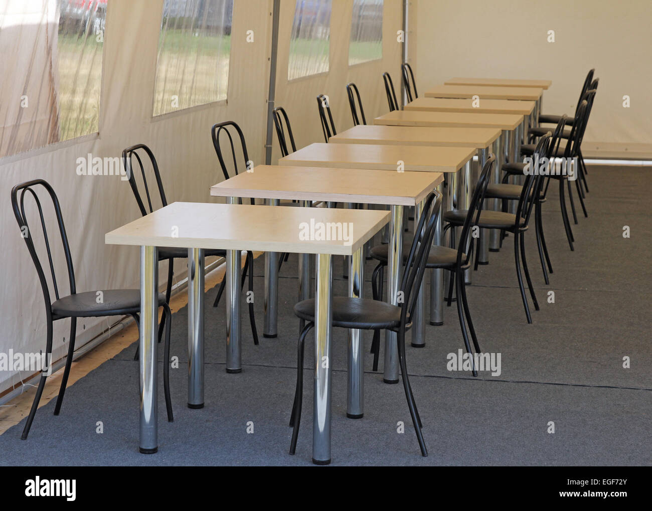 tables and chairs in the dining room in the tent camp Stock Photo - Alamy