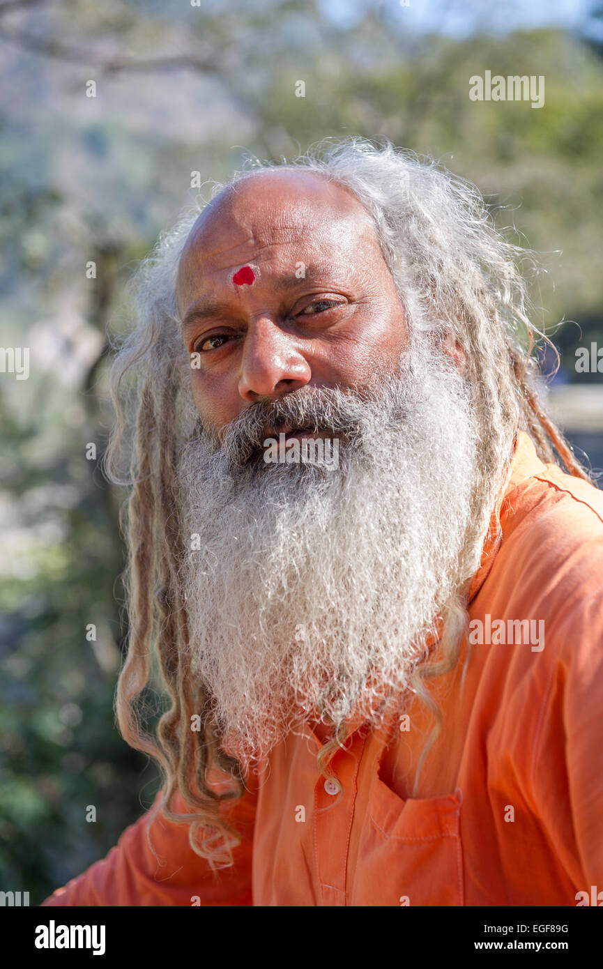 A Sadhu or Holy Man sat above the Ganges in the Himalayan foothills of ...