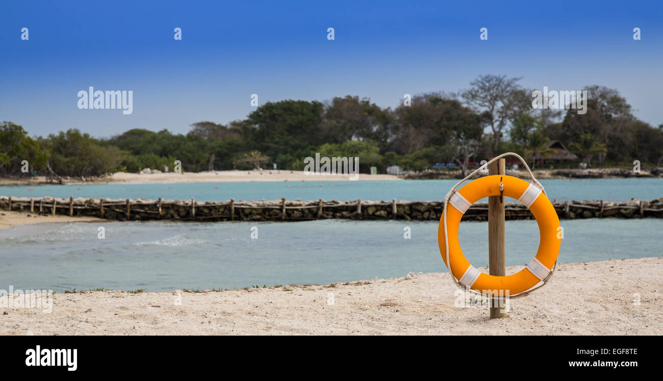 Life rings stand at the ready along the beach at a Caribbean resort ...