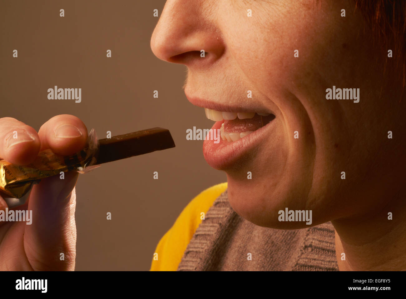 Symbolic picture about sugar in foods: Woman eating chocolate Stock ...
