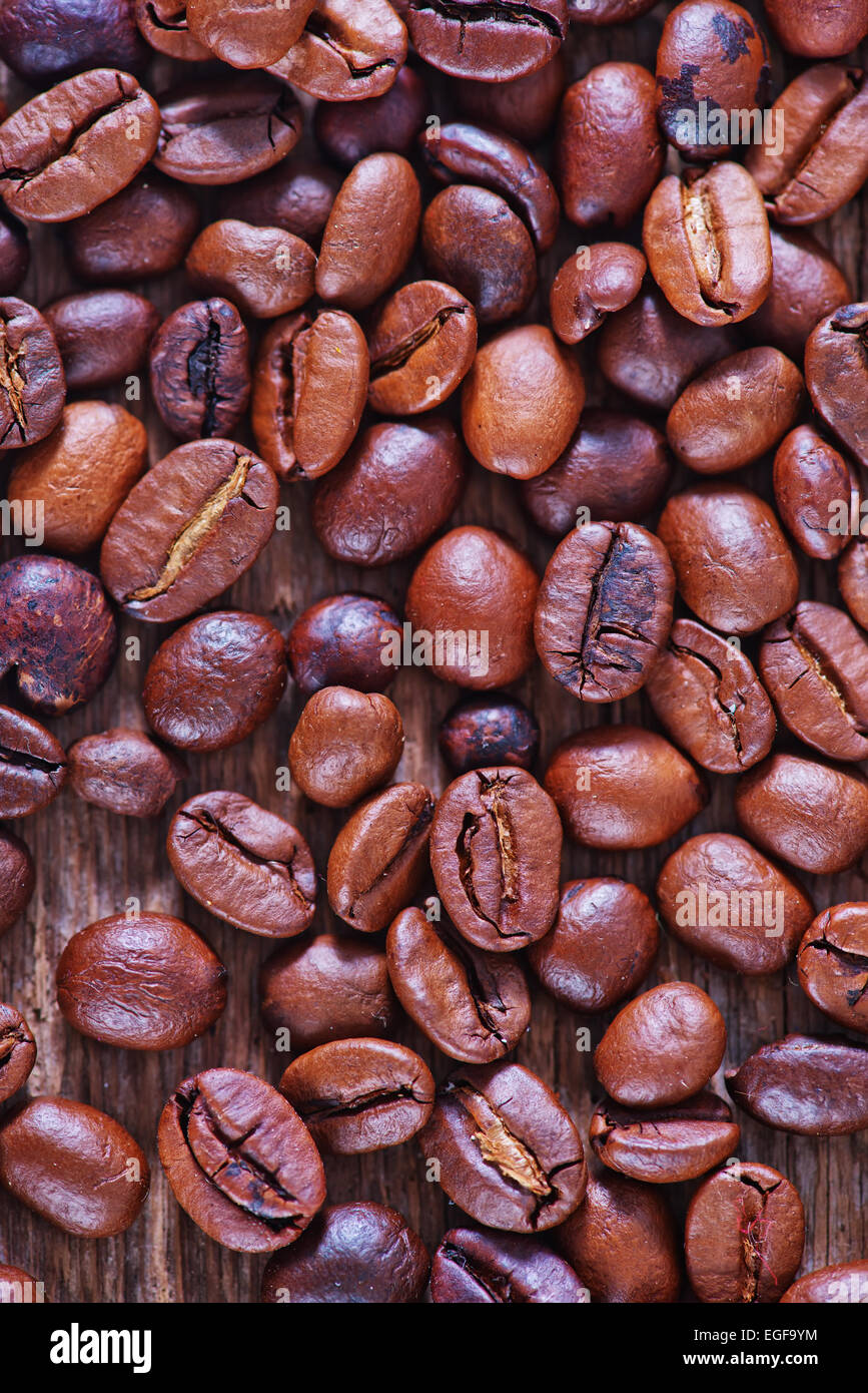 dry coffee beans on the wooden table Stock Photo - Alamy