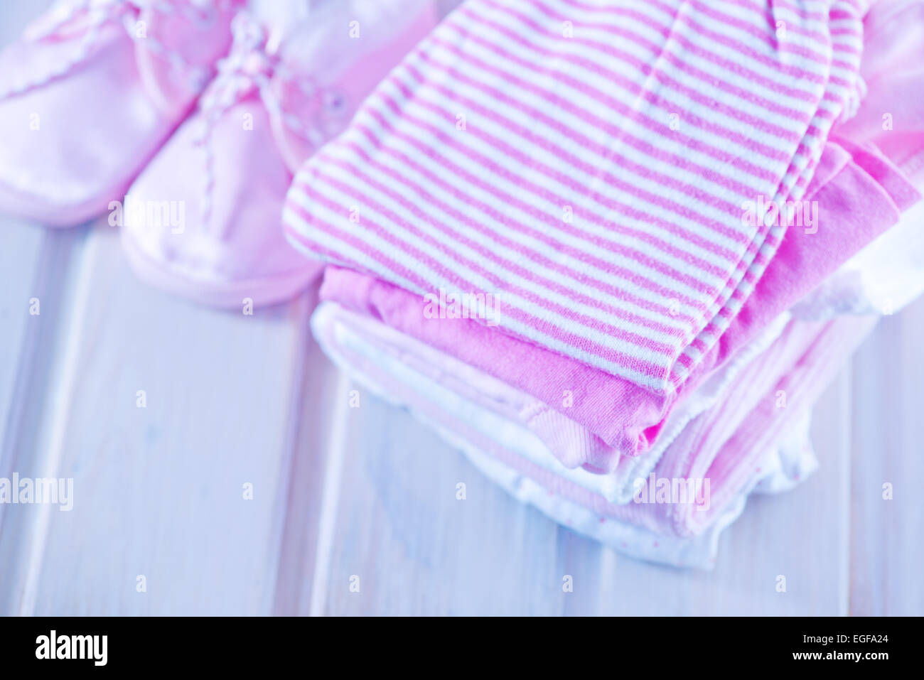 baby clothes for girl on a table Stock Photo - Alamy