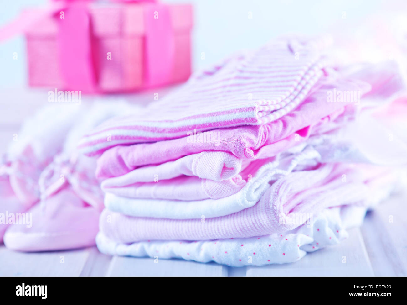 baby clothes for girl on a table Stock Photo - Alamy