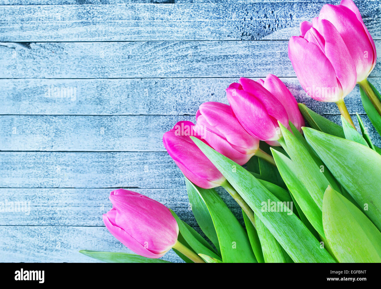 flowers on the wooden table, spring background Stock Photo - Alamy