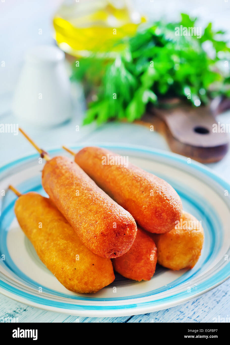 corndogs on plate and on a table Stock Photo - Alamy