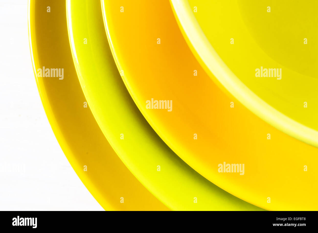 Colorful stack of plates for the concept background Stock Photo - Alamy