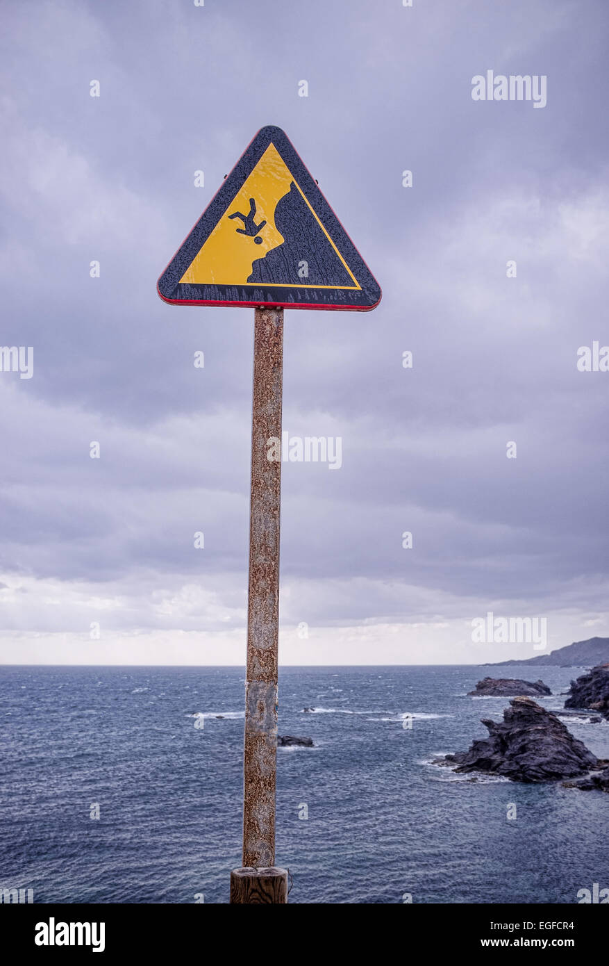A warning sign on top of a high cliff Stock Photo - Alamy