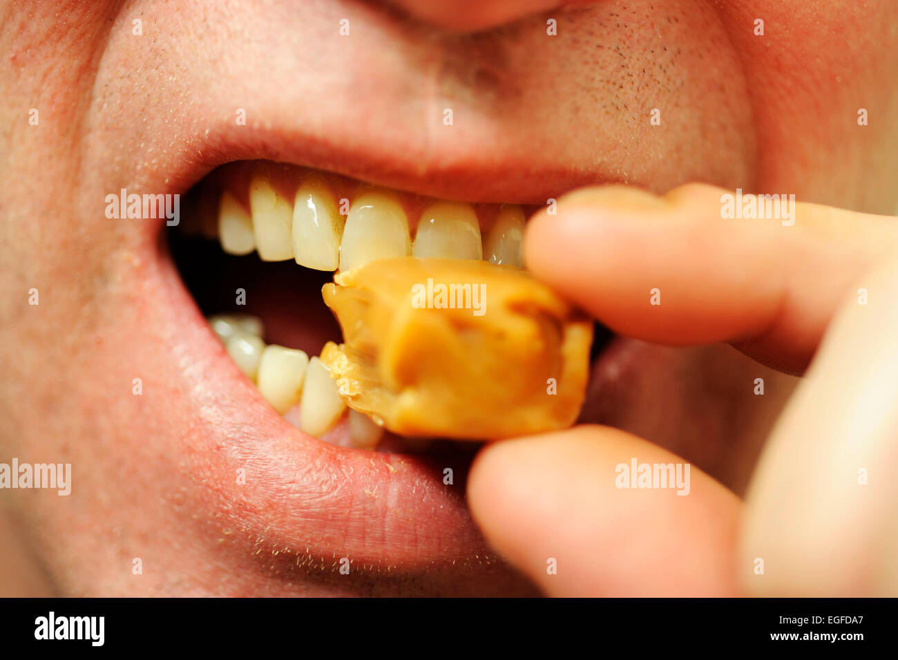 Male Eating Toffee Sweets Stock Photo - Alamy